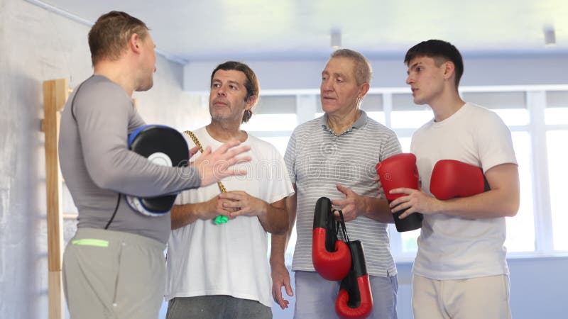 Group of Men are Talking after Successful and Tedious Boxing Workout ...