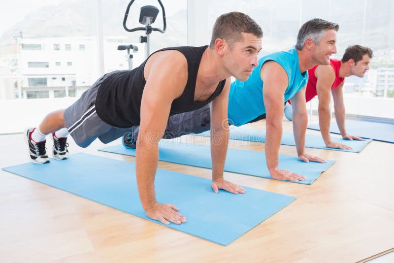 Group of Men Working on Exercise Mat Stock Image - Image of fitness ...