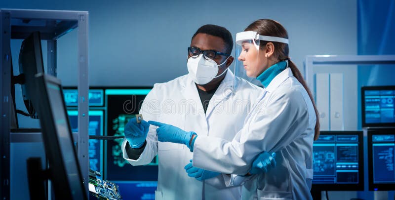 Group of Microelectronic Engineers Discussing in a Modern ...