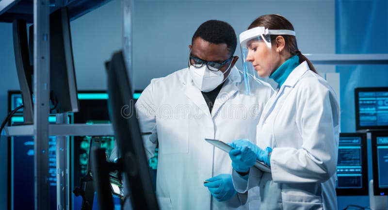 Group of Microelectronic Engineers Discussing in a Modern ...