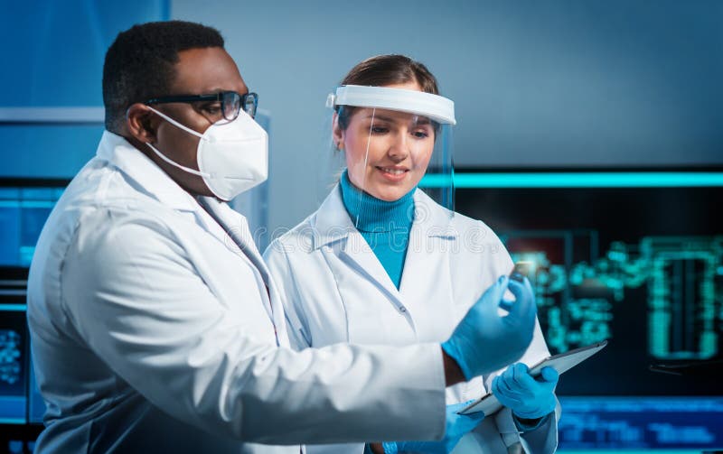 Group of Microelectronic Engineers Discussing in a Modern ...