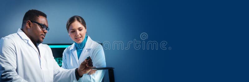 Group of Microelectronic Engineers Discussing in a Modern ...