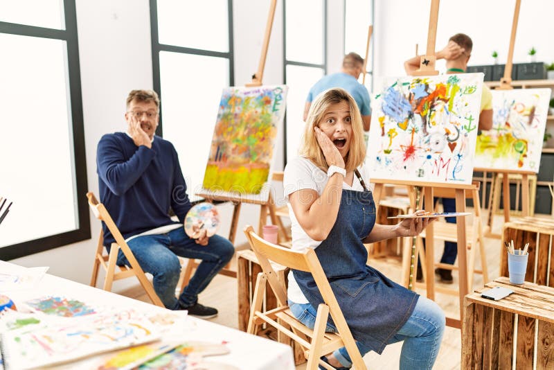 Group of Middle Age Artist at Art Studio Afraid and Shocked, Surprise ...