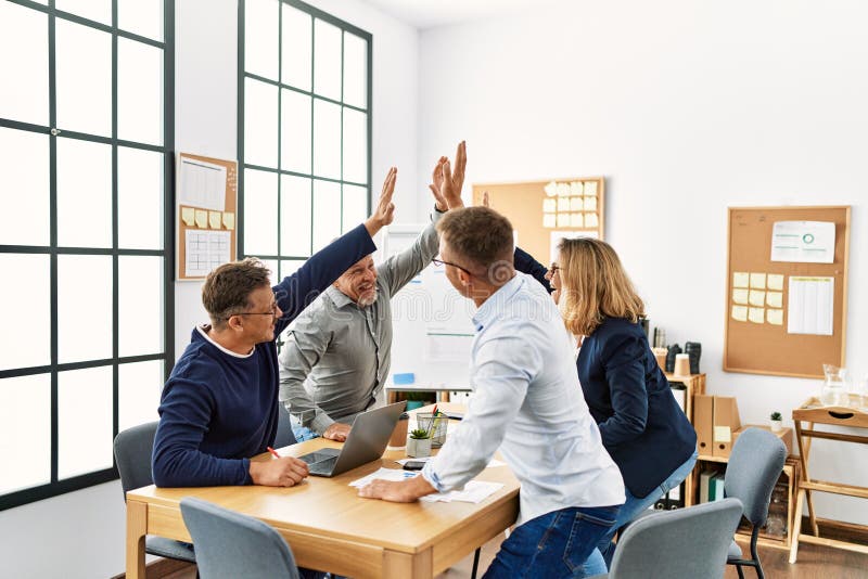 Group of Middle Age Business Workers High Five at the Office Stock ...