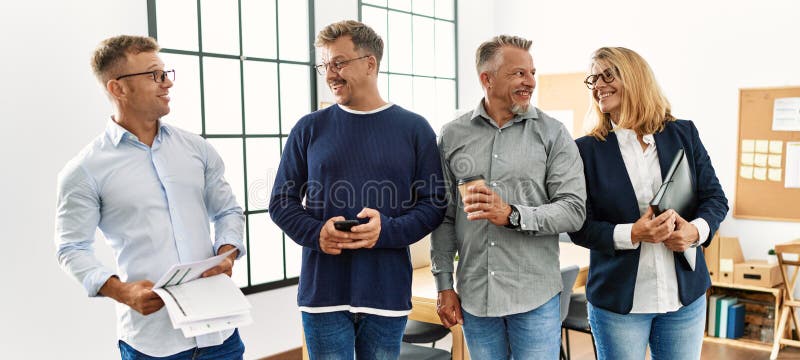 Group of Middle Age Business Workers Smiling Happy Standing at the ...