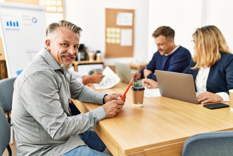 Group of Middle Age Business Workers Working Stock Photo - Image of ...