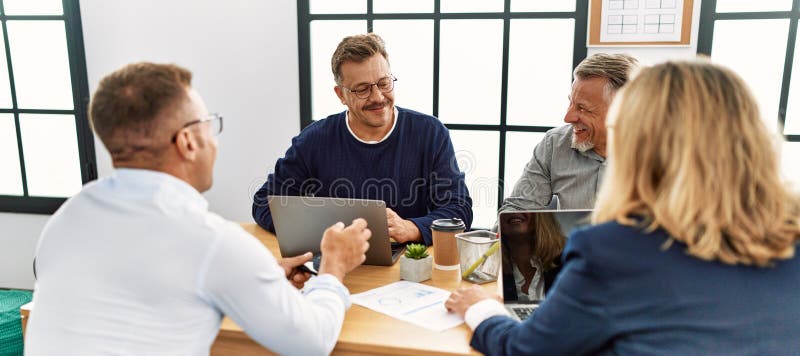 Group of Middle Age Business Workers Working at the Office Stock Image ...