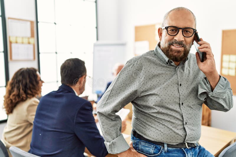 Group of Middle Age Business Workers Working at the Office Stock Image ... Group of Middle Age Business Workers Working at the Office Stock Image ...