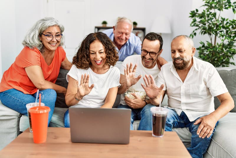 Group of Middle Age Friends Having Video Call Using Laptop at Home ...