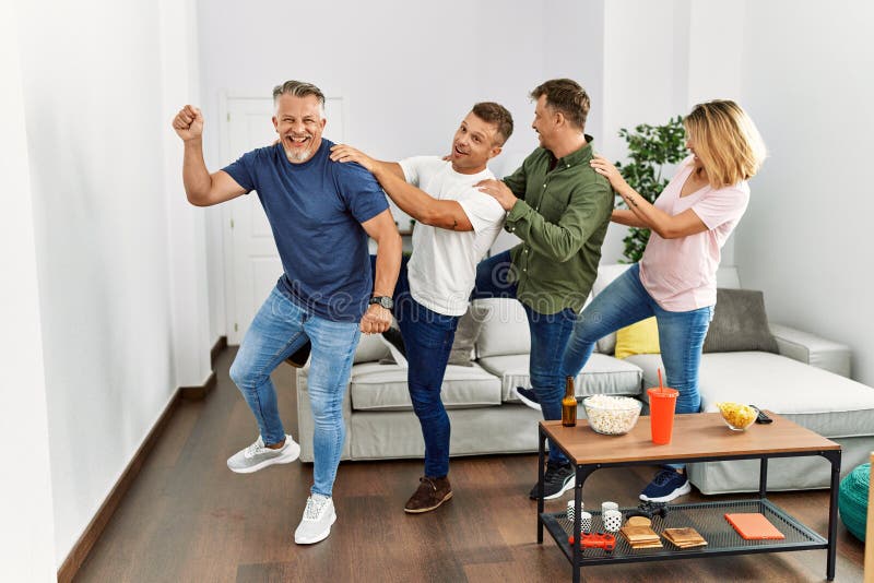 Group of Middle Age Friends on Party Dancing at Home Stock Photo ...