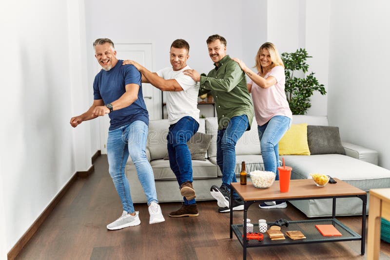 Group of Middle Age Friends on Party Dancing at Home Stock Image ...