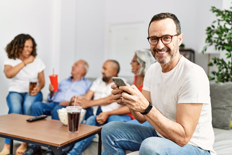 Group of Middle Age Friends Sitting on the Sofa Speaking Stock Image ...