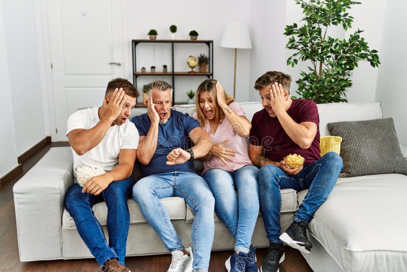 Group of Middle Age People Sitting on the Sofa at Home Looking at the ...