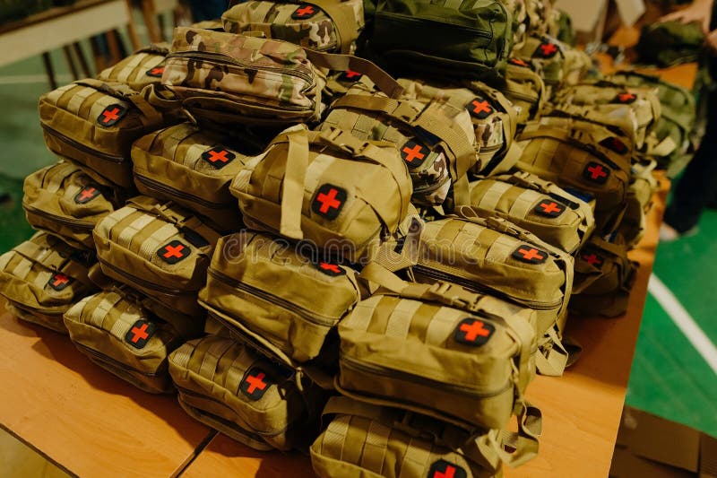 A Group of Military First Aid Kits on a Table. Tactical First Aid Kits ...