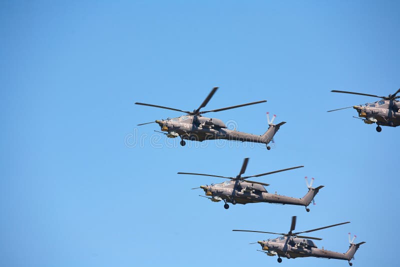 Group Military Helicopters Against the Blue Sky. Editorial Photography ...