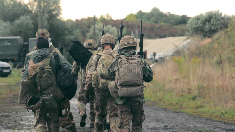 A Group of Military Men Returning after Completing a Task. Soldiers in ...
