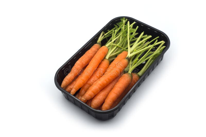 Mini Carrots in a Plastic Tray on White Background Stock Image - Image ...