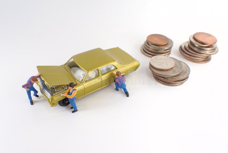 Miniature Mechanics Work on a Gold Toy Car. Stock Image - Image of ...
