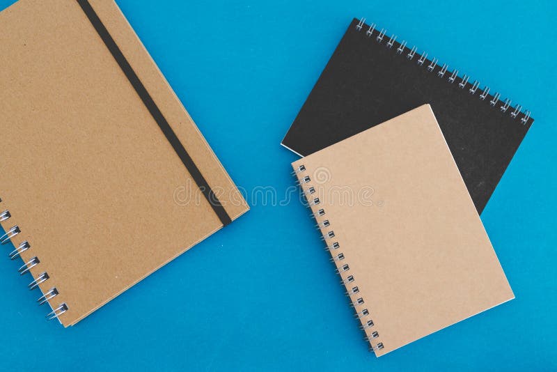 Group of Minimalist Looking Notebooks of Different Shapes on Blue Stock ...
