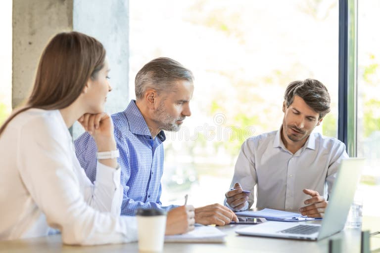 Group of Modern People Using Modern Technologies while Working in the ...