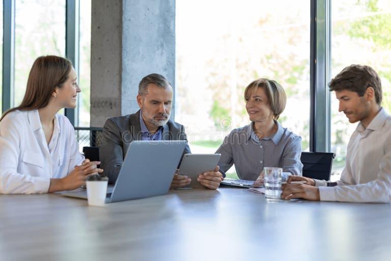 Group of Modern People Using Modern Technologies while Working in the ...