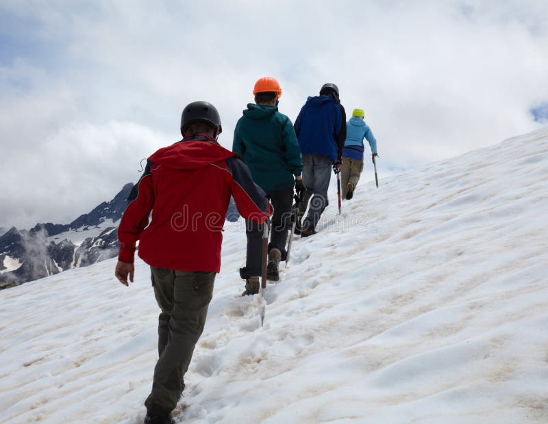 Group of Mountaneers in High Mountains Stock Photo - Image of clouds ...