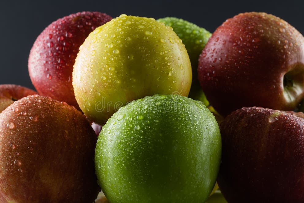 A Group of Multi-colored Apples Sprayed Water Drops. Stock Photo ...