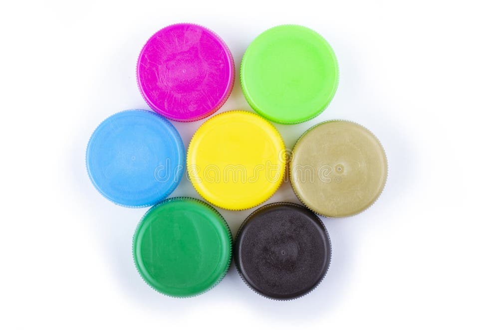 Group of Multi Colored Bottle Caps on a White Background. Recycling and ...