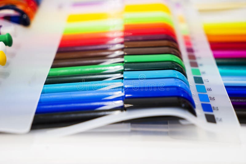 A Group Multi-colored Plastic Ballpoint Pens on White Table. Stock ...