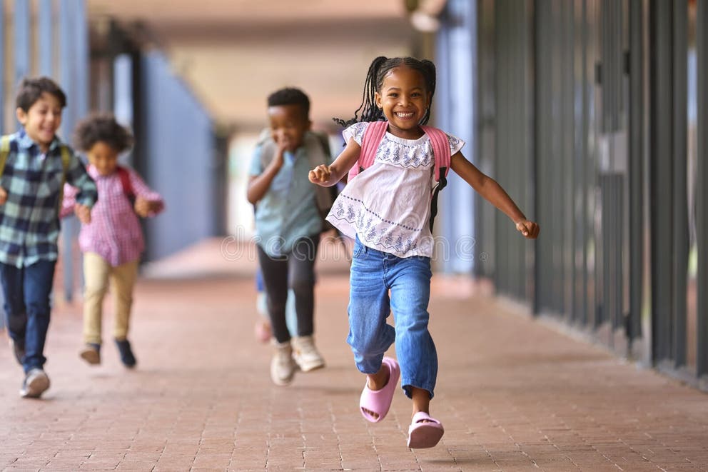 Group of Multi-Cultural Elementary School Pupils Running Along Walkway ...