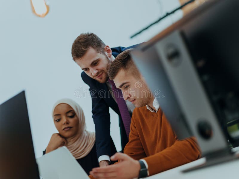 Group of Multi-ethnic Colleagues Working on Desktop Computers, Laptop ...