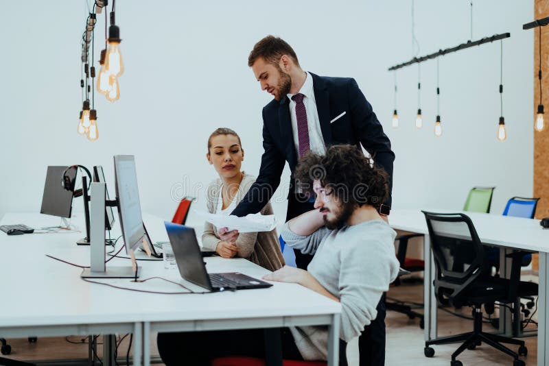 Group of Multi-ethnic Colleagues Working on Desktop Computers, Laptop ...