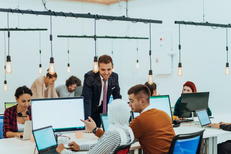Group of Multi-ethnic Colleagues Working on Desktop Computers, Laptop ...