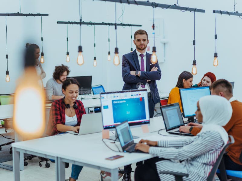 Group of Multi-ethnic Colleagues Working on Desktop Computers, Laptop ...