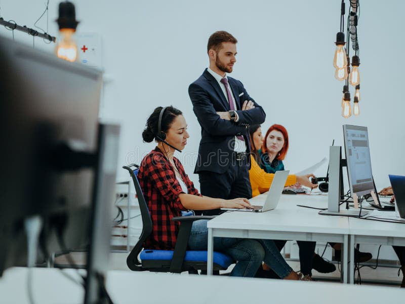 Group of Multi-ethnic Colleagues Working on Desktop Computers, Laptop ...
