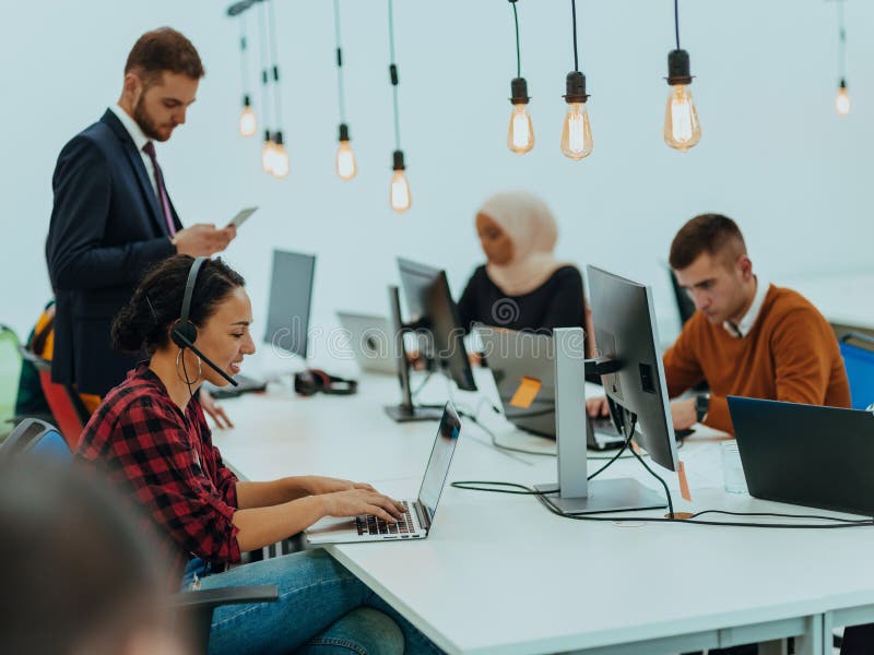 Group of Multi-ethnic Colleagues Working on Desktop Computers, Laptop ...