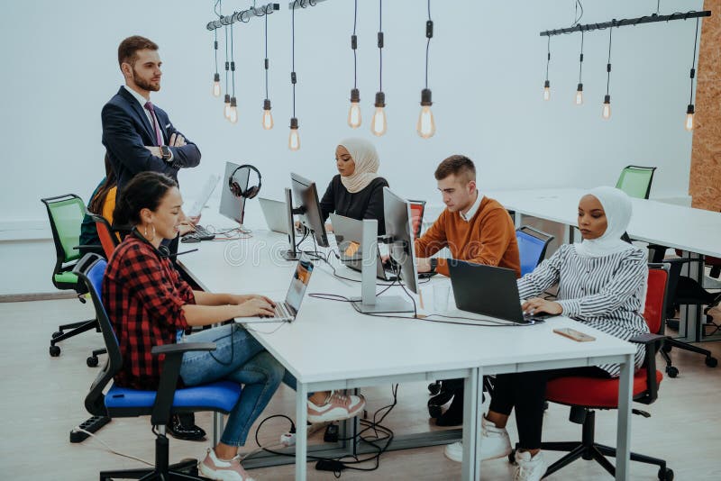 Group of Multi-ethnic Colleagues Working on Desktop Computers, Laptop ...