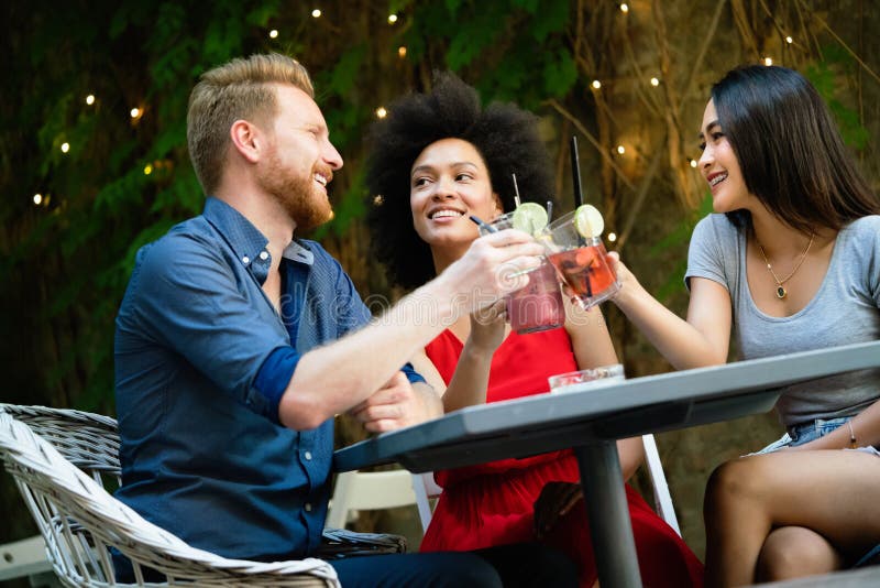 Group of Diverse Friends Talking and Having Fun at Cafe Outdoor Stock ...