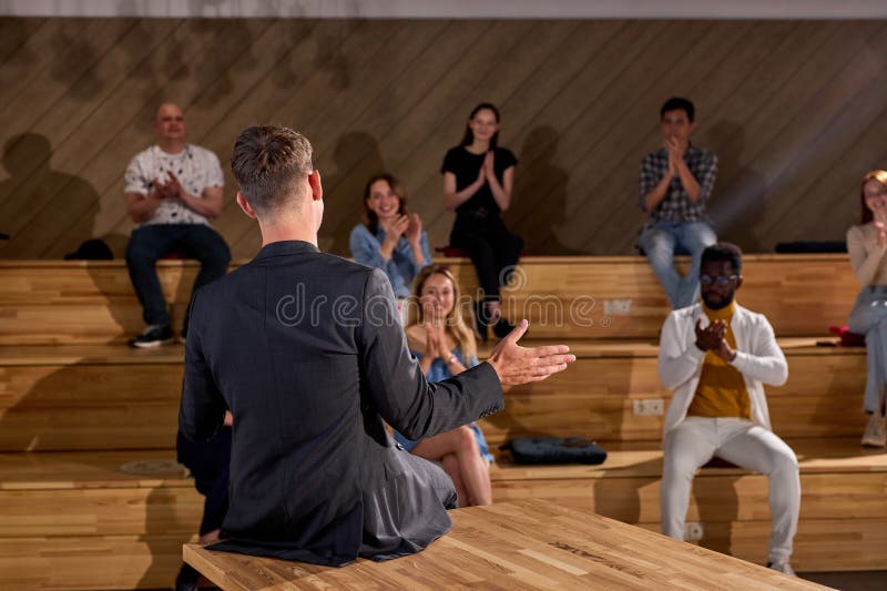 Group of Multi-ethnic People Clapping Hands after Speaking of Man Couch ...