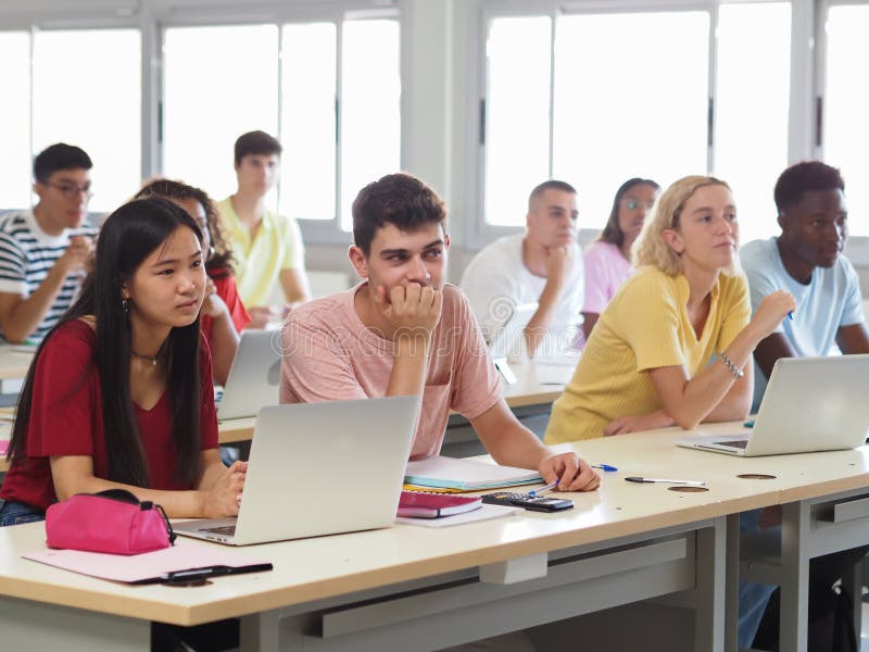 Group of Multi-ethnic Teenage Student Listening To the Lesson in Class ...