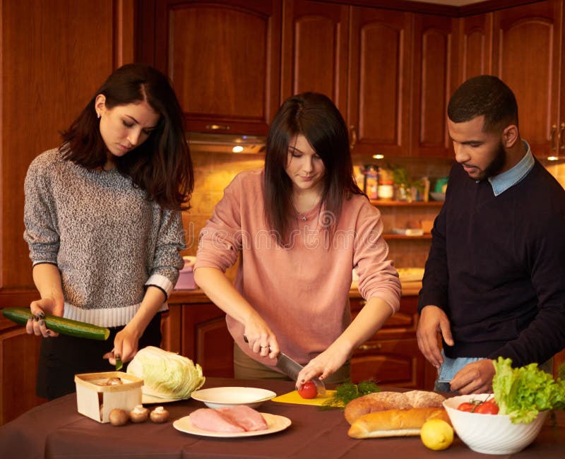 Group of Multi Ethnic Young Friends in Kitchen Prepare for Party Stock ...