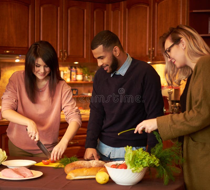 Group of Multi Ethnic Young Friends in Kitchen Prepare for Party Stock ...