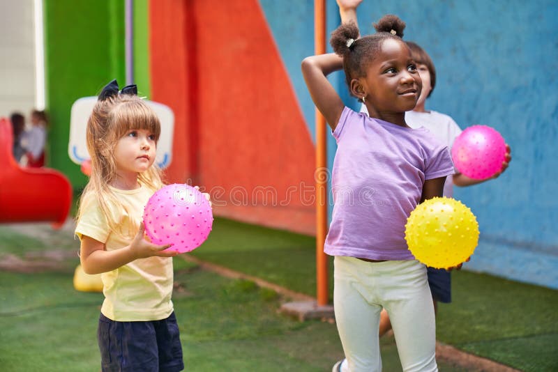 Group of Multicultural Children Playing Ball Stock Photo - Image of ...