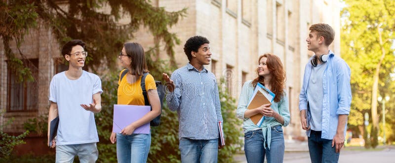Group of Multicultural First-Year Students Walking Near University ...