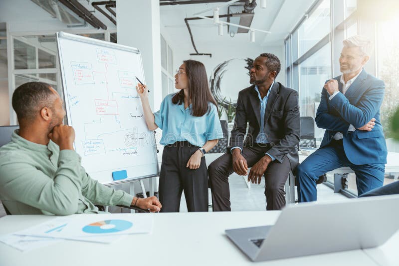 Group of Multiethnic Business People Working Together on Project while ...