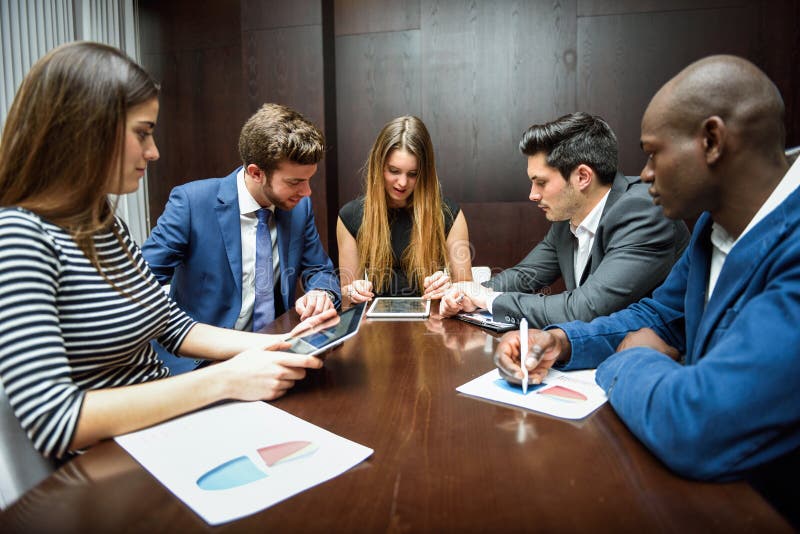 Group of Multiethnic Busy People Working in an Office Stock Photo ...