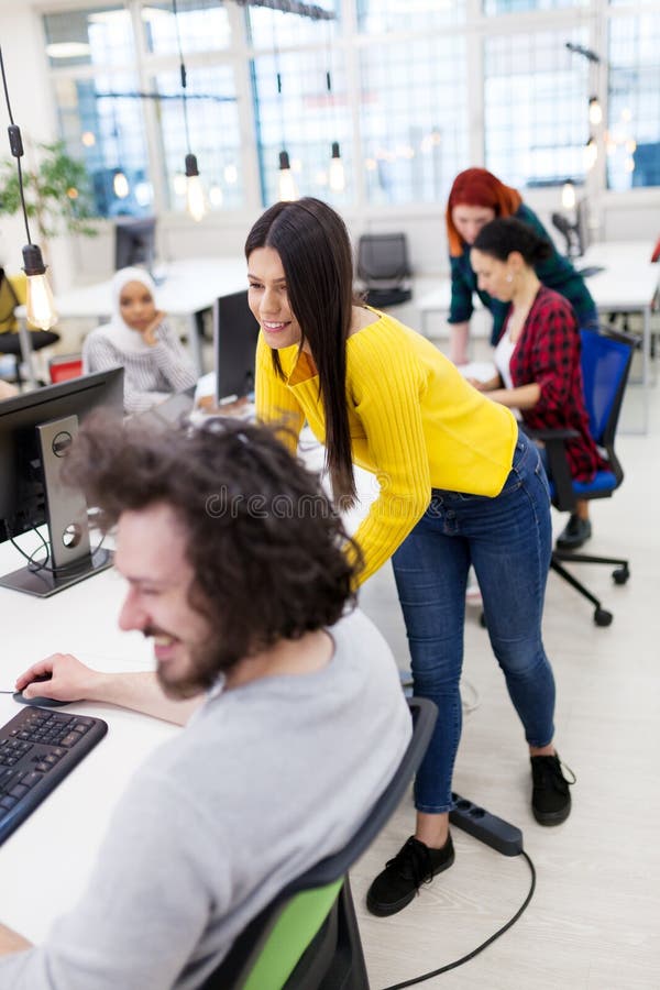 Group of Multiethnic Colleagues Working on Desktop Computers in a ...