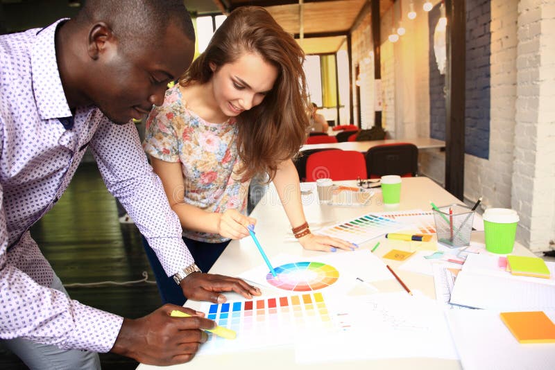 Group of Multiethnic Designers Brainstorming. Young Designers Working Together on Creative ...