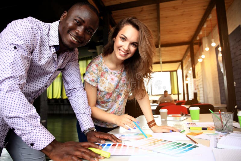 Group of Multiethnic Designers Brainstorming. Young Designers Working ...