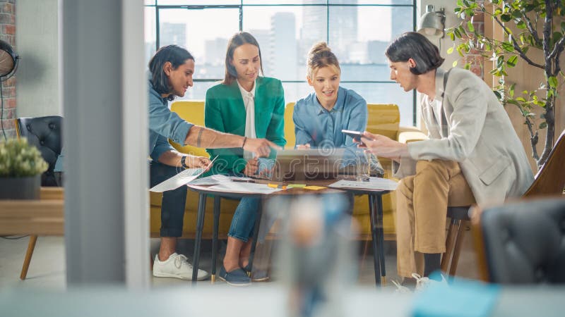 A Group of Multiethnic Enthusiastic Students Comparing Research ...